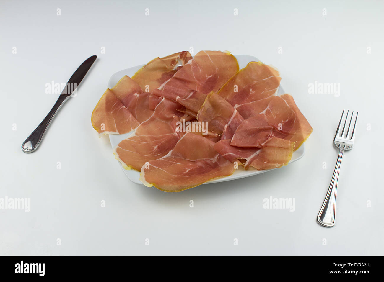 Parma luxury ham in a typical Mediterranean dish, as appetizer Stock ...