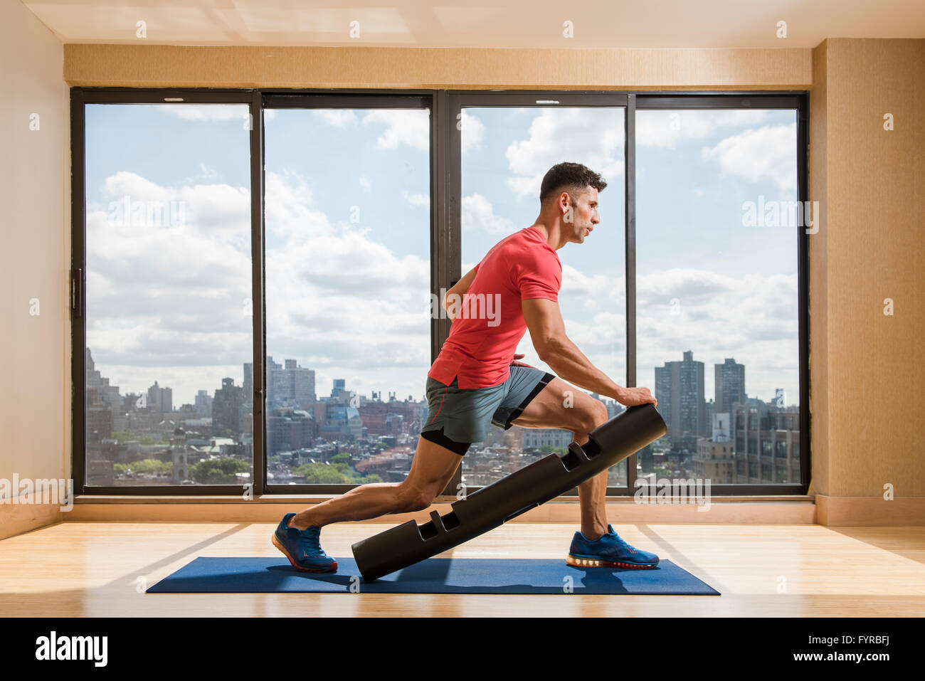 Athlete working out with Vipr Stock Photo - Alamy