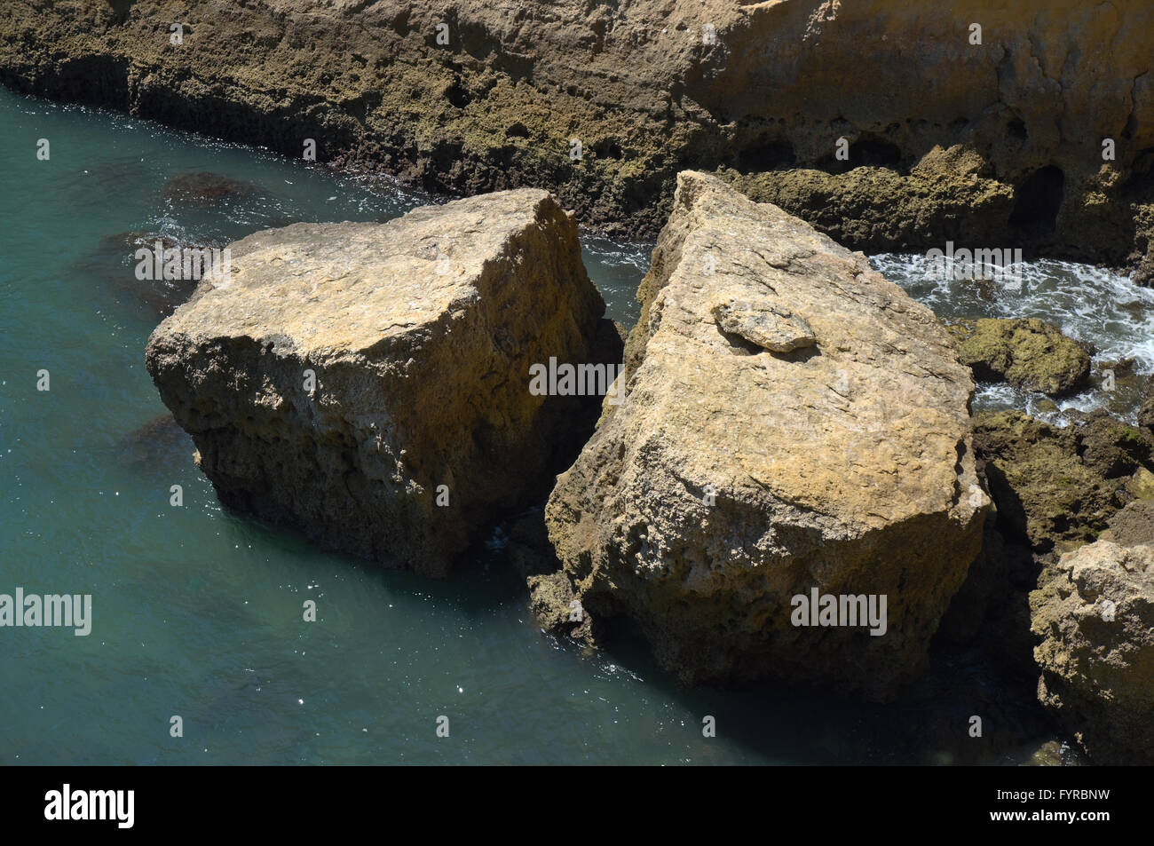 Boulder broken in half near Albandeira beach, Algarve, Portugal ...