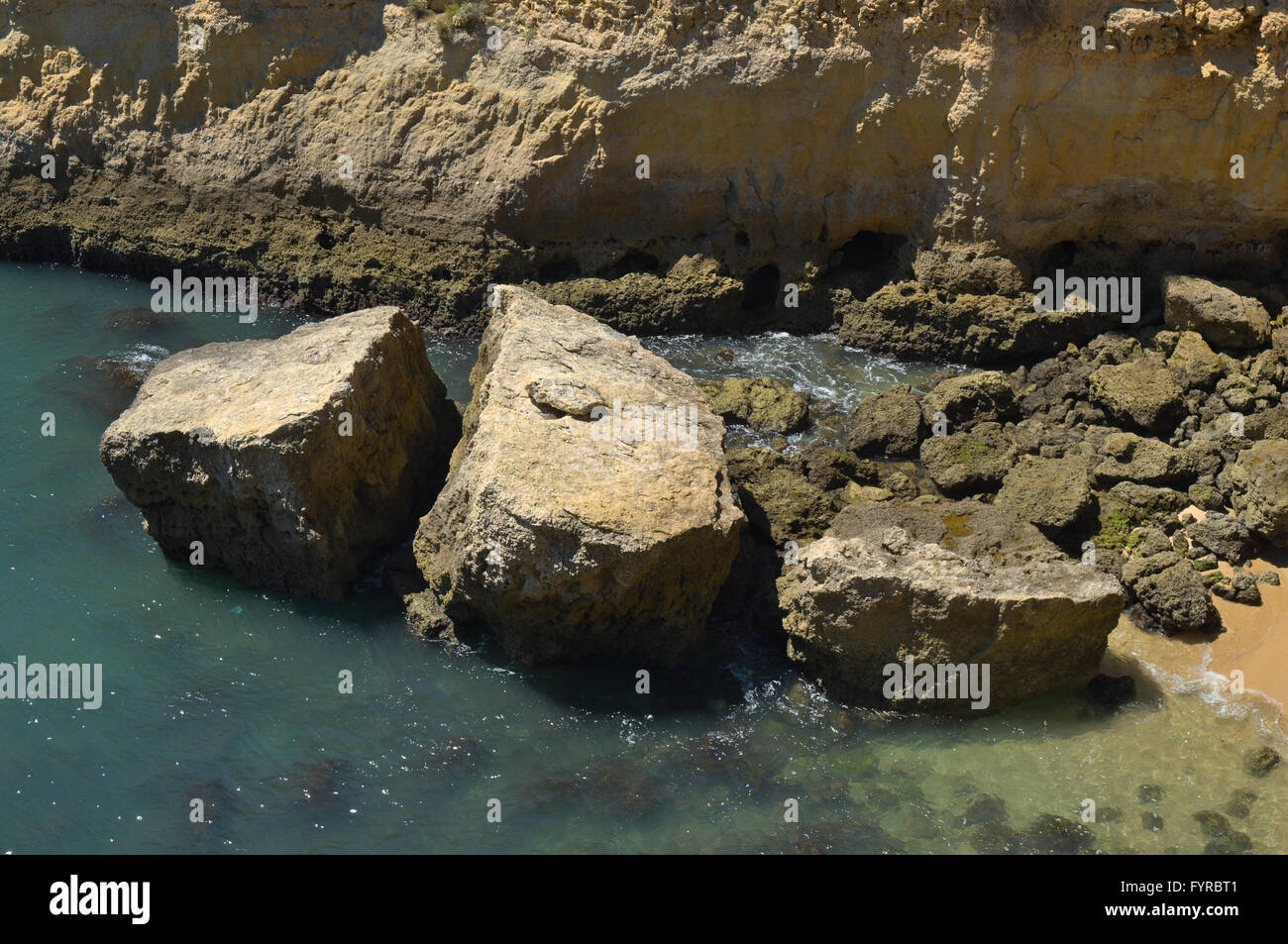 Boulder broken in half near Albandeira beach, Algarve, Portugal ...