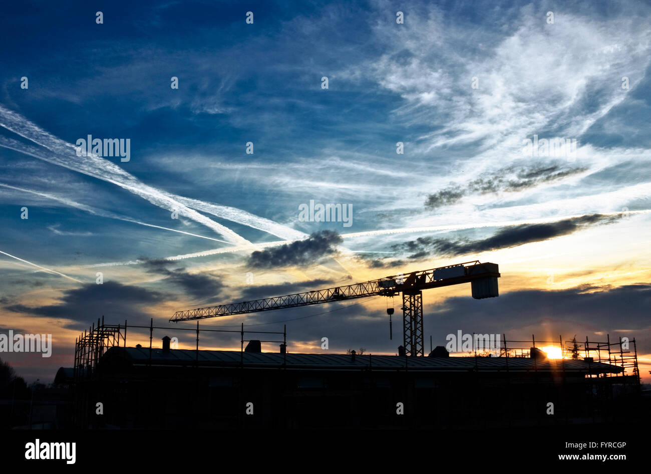 Sunset on the building site Stock Photo - Alamy