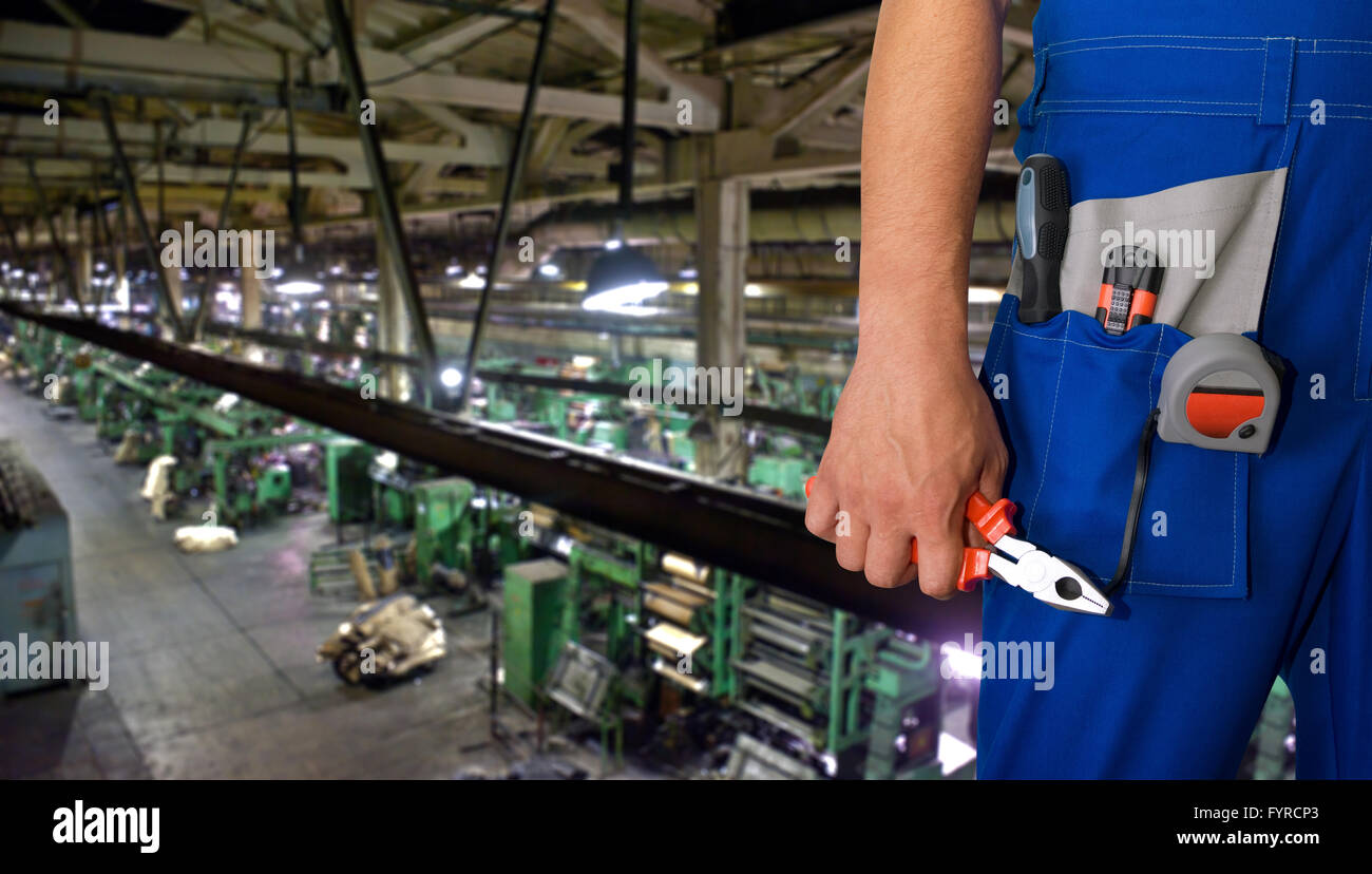 Worker with instruments Stock Photo - Alamy