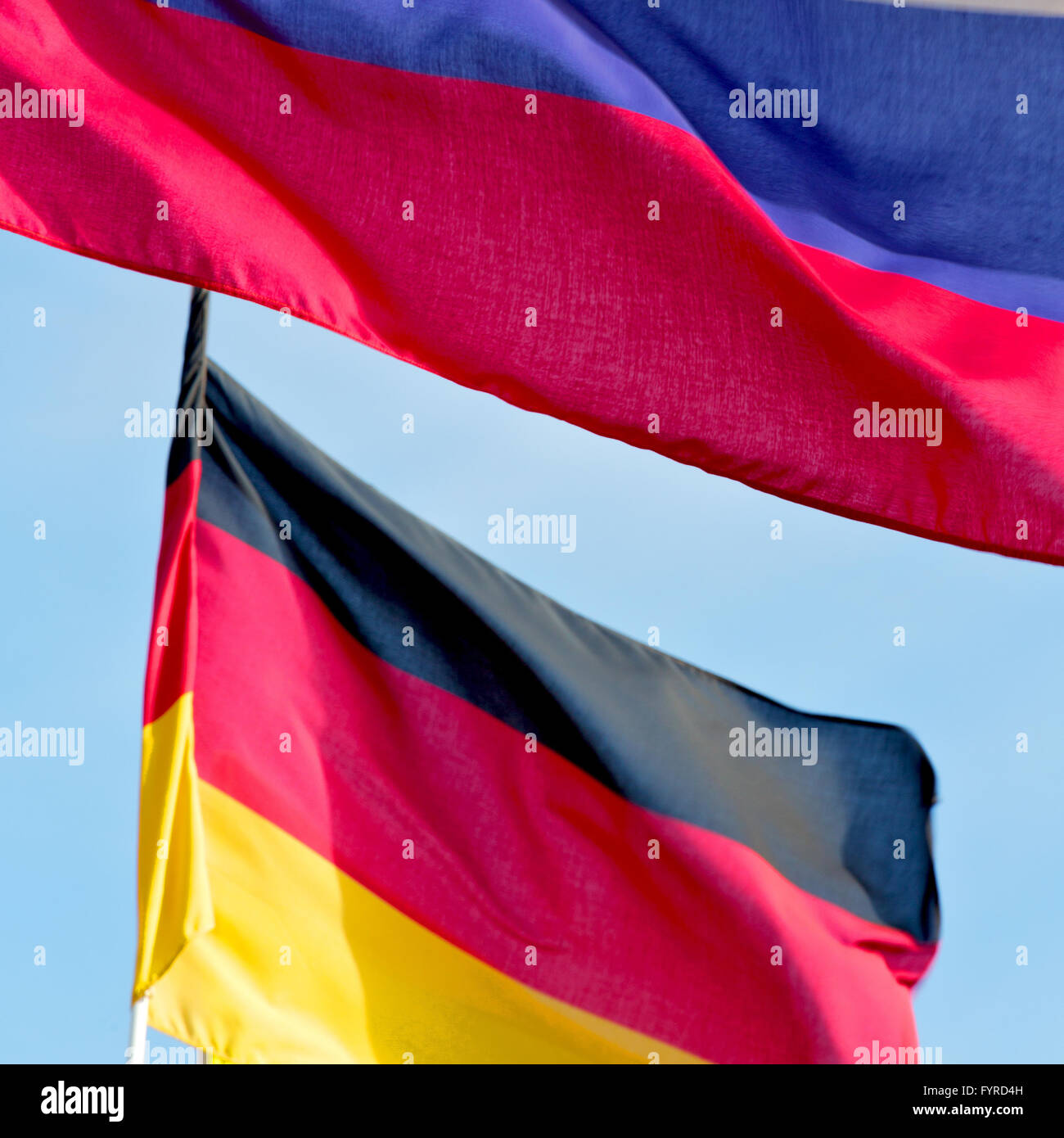 world waving flag in the blue sky colour and spain Stock Photo - Alamy