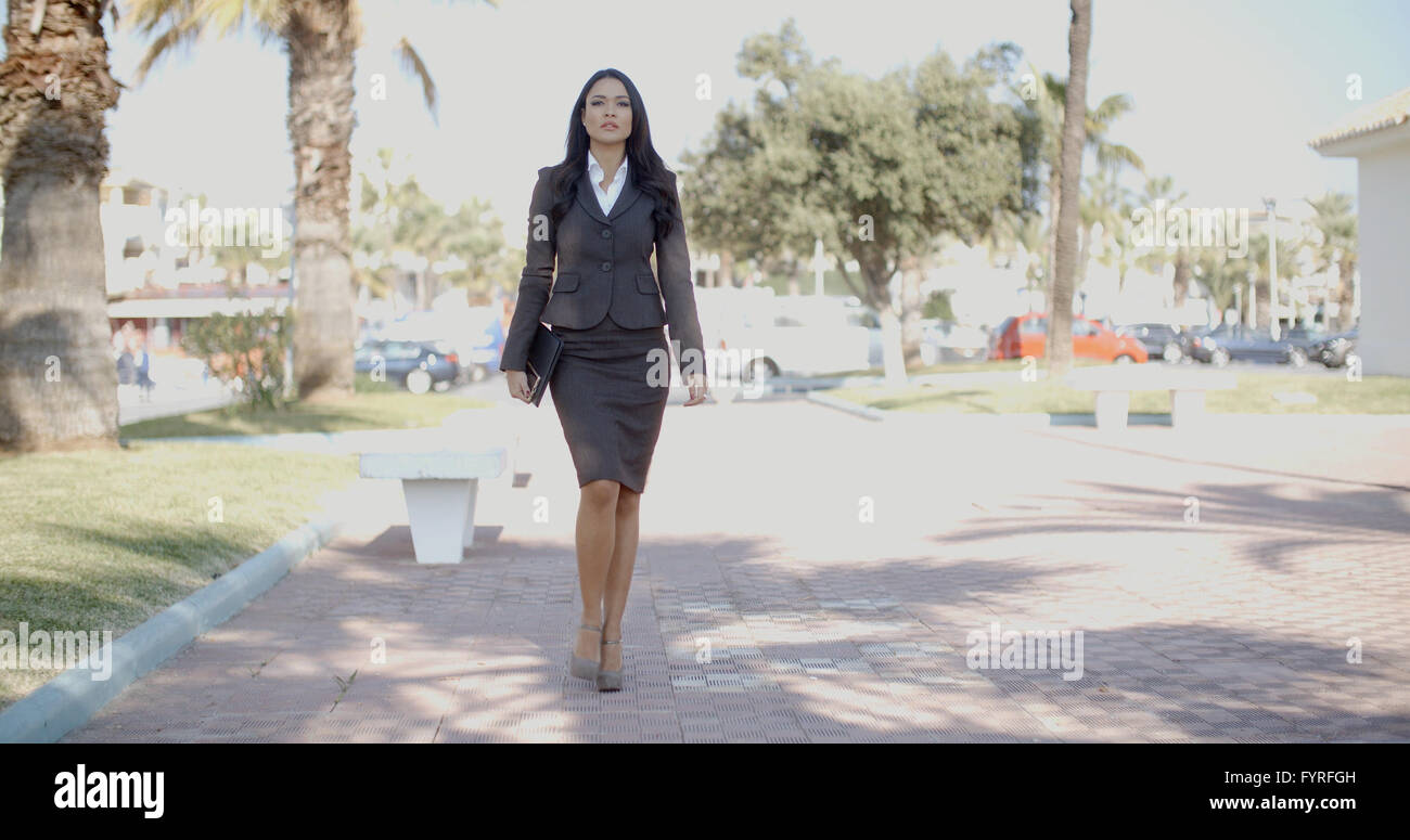 Lady walking down a street hi-res stock photography and images - Alamy