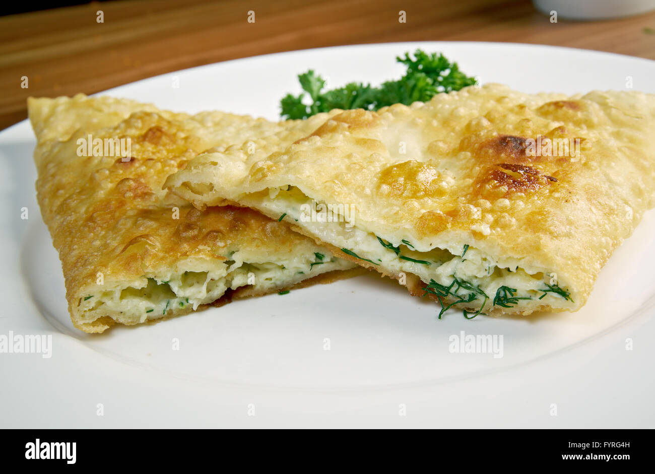 Cheburek with cheese Stock Photo - Alamy