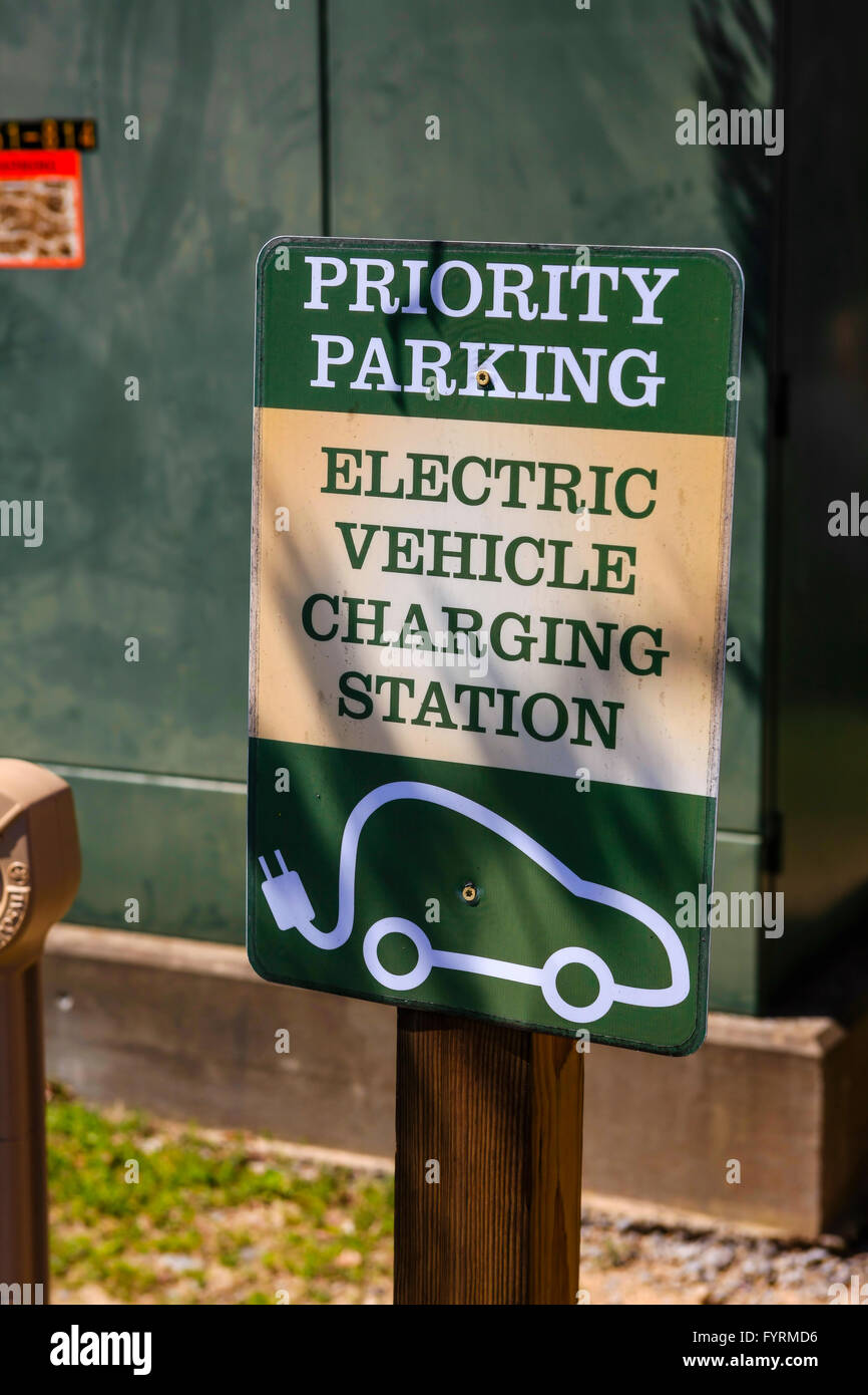 Priority Parking - Electric vehicle charging station sign at the ...