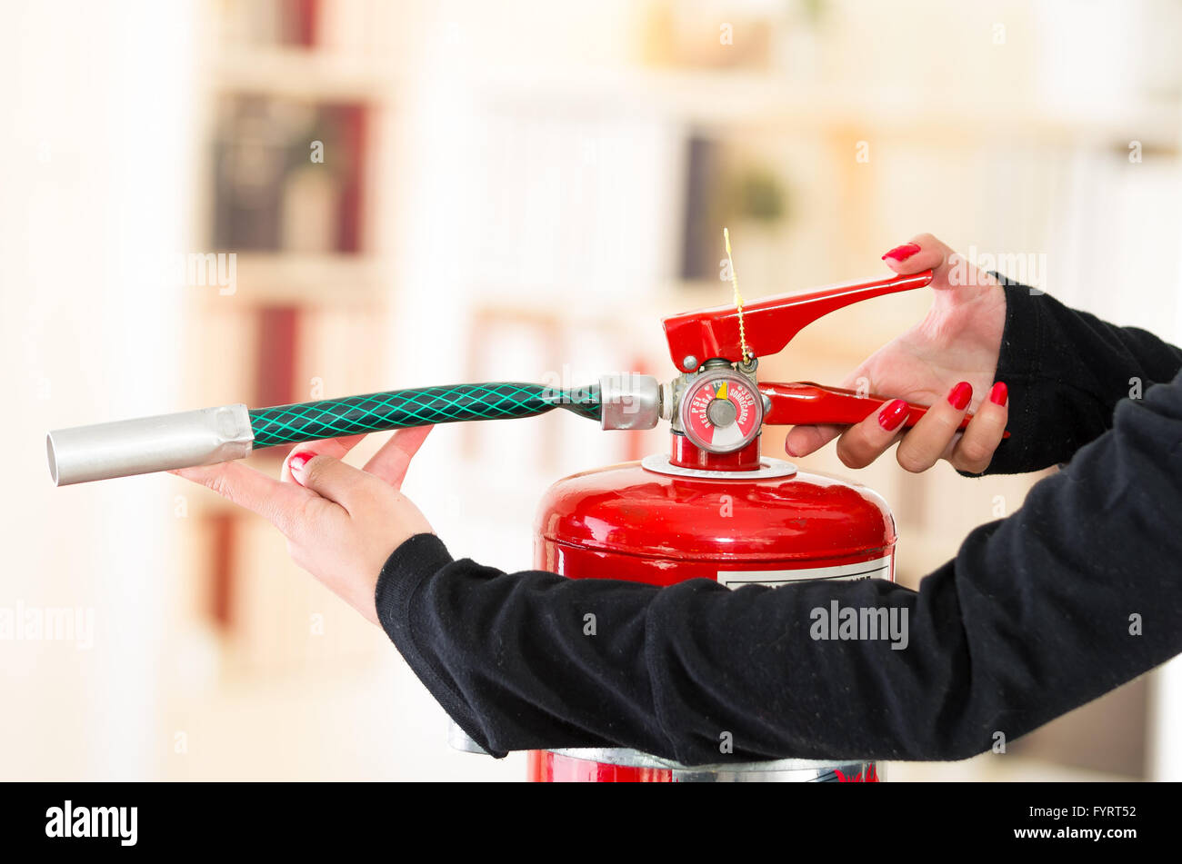 Hand holding fire extinguisher hi-res stock photography and images - Alamy