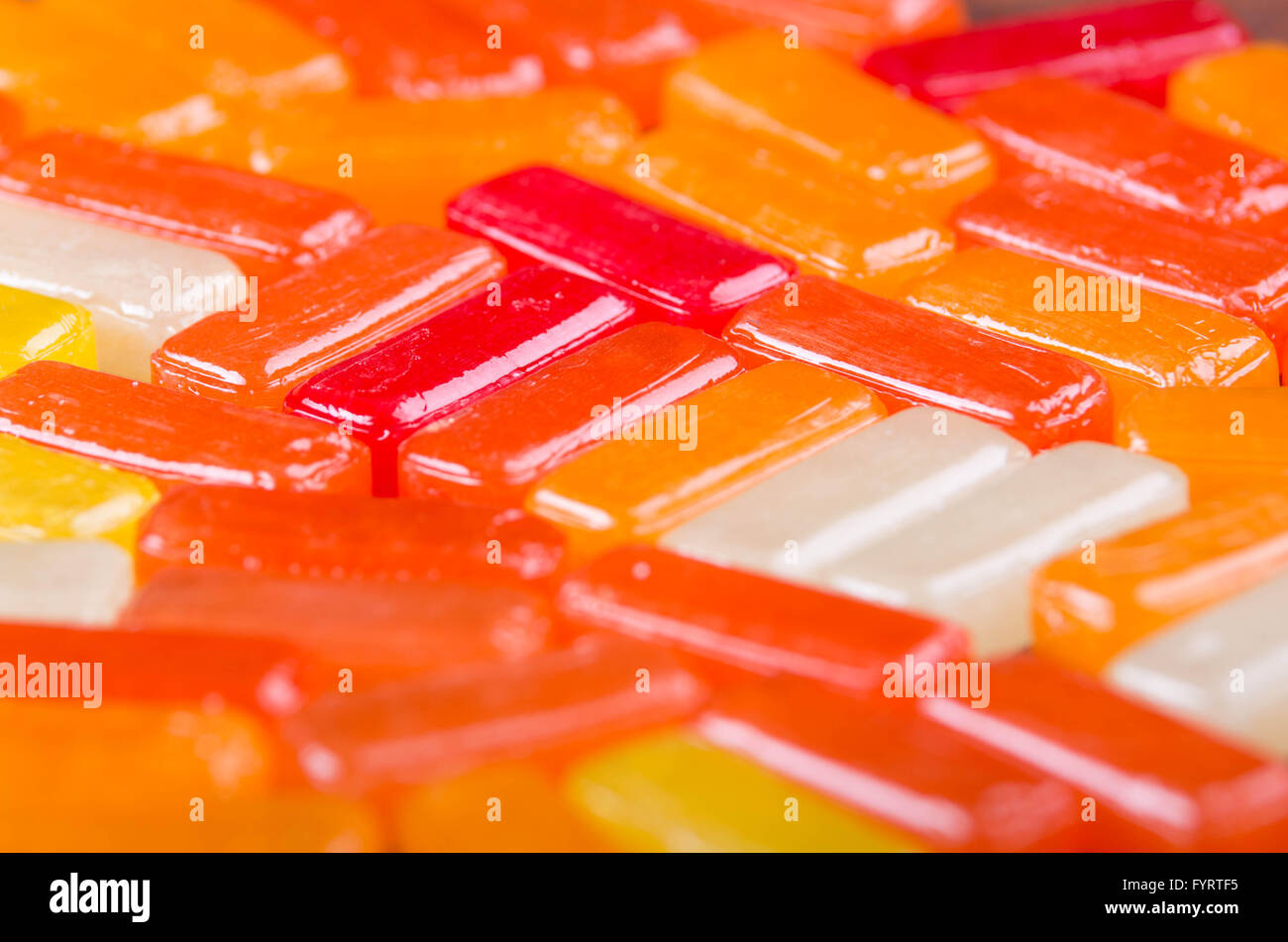 Closeup rectangular colorful shiny hard candy lined up Stock Photo - Alamy