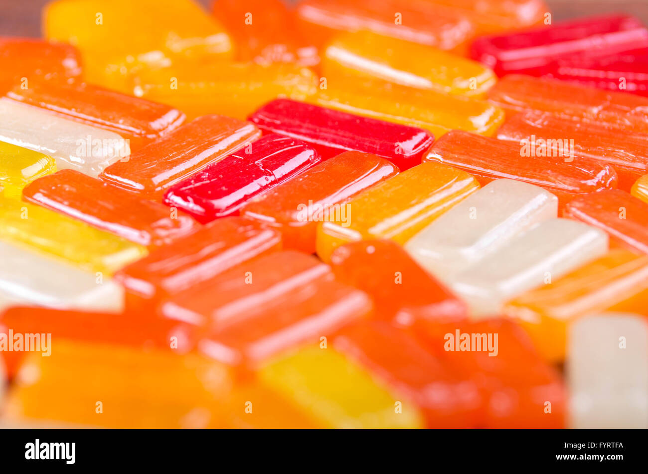 Closeup rectangular colorful shiny hard candy lined up Stock Photo - Alamy