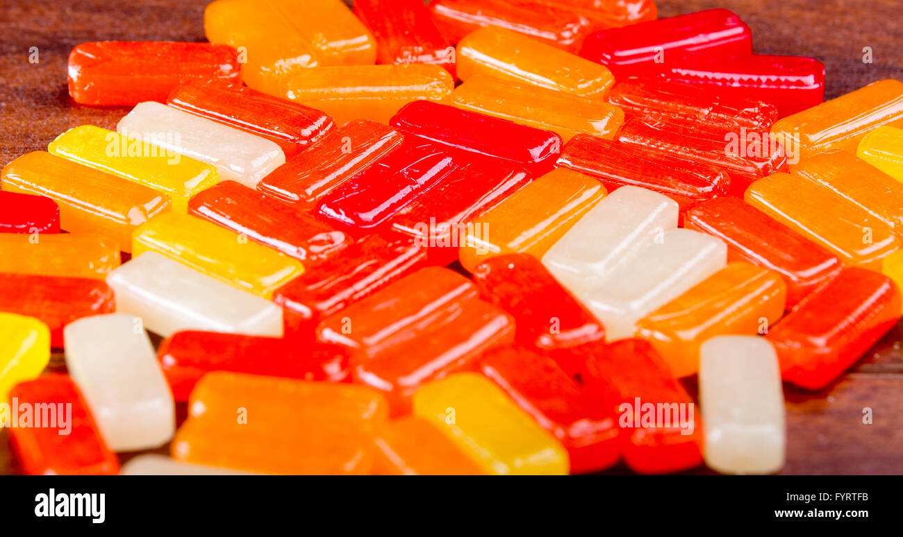 Closeup rectangular colorful shiny hard candy lined up Stock Photo - Alamy