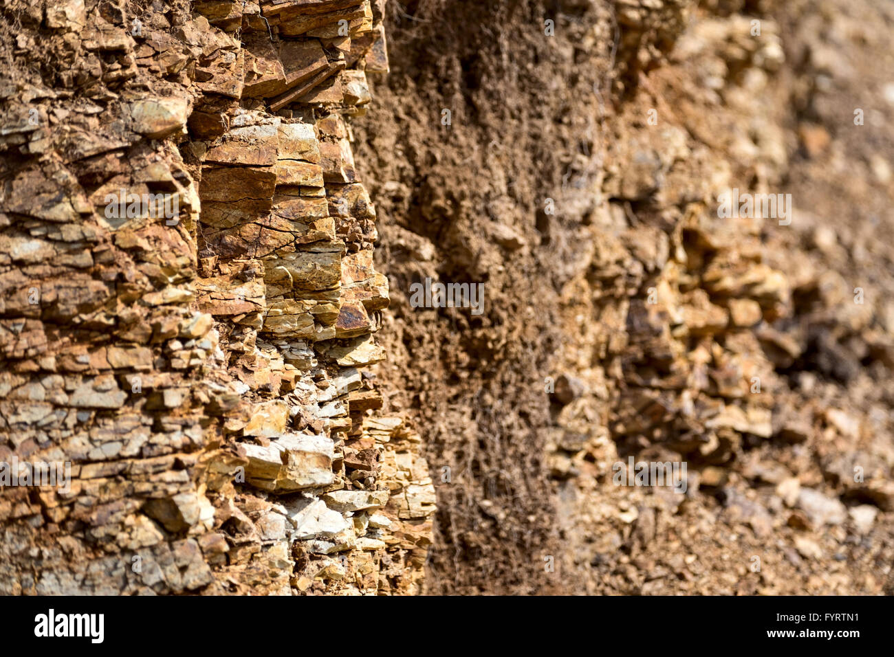 Background with cracked stones in ravine wall Stock Photo - Alamy