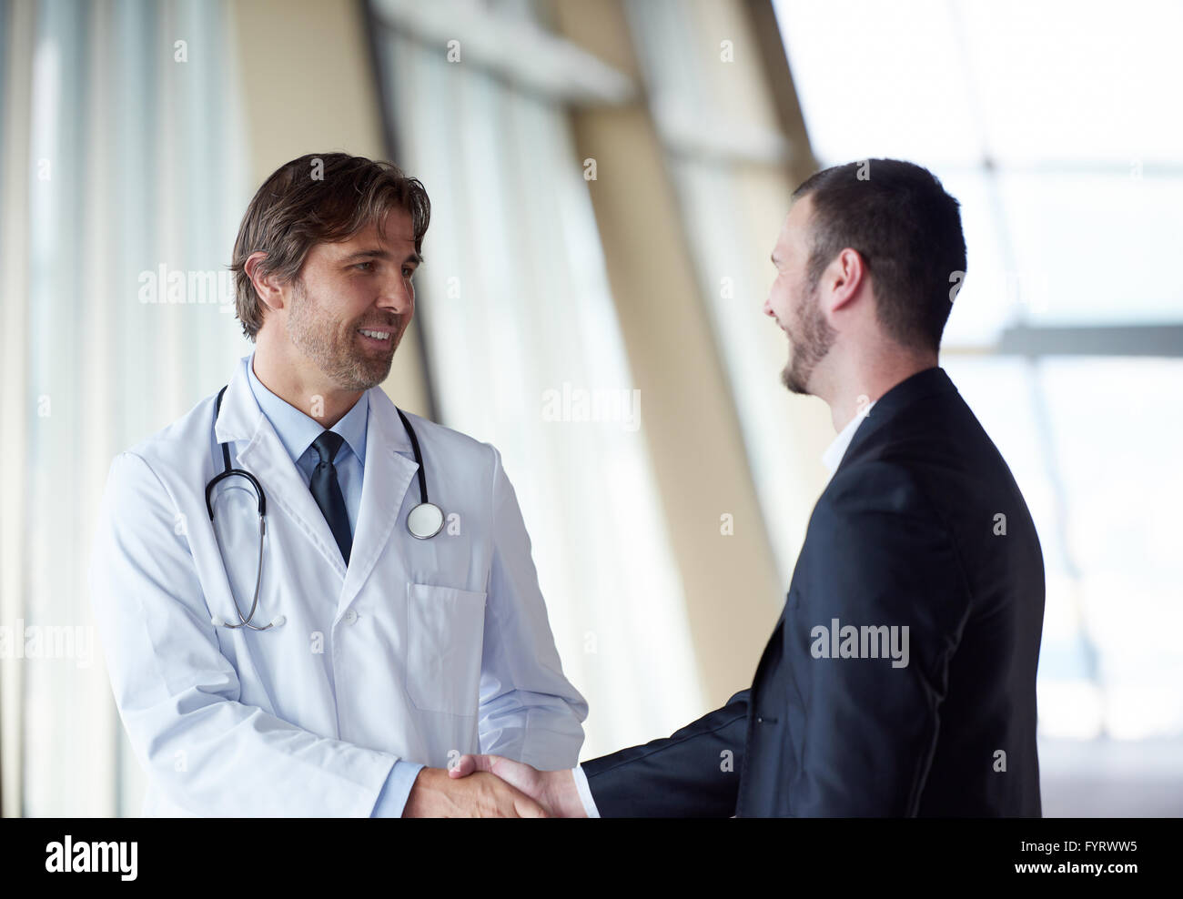doctor handshake with a patient Stock Photo - Alamy