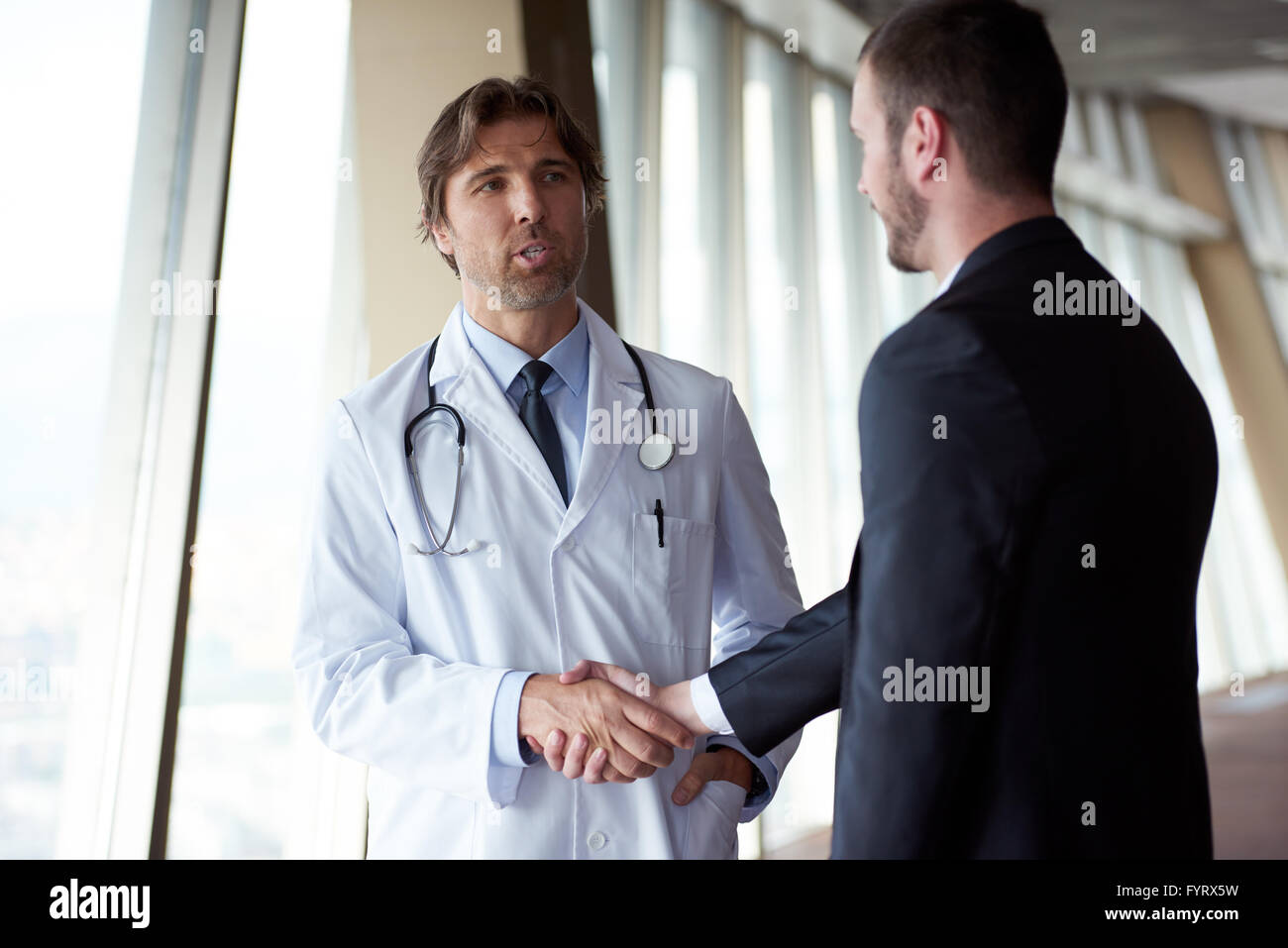 doctor handshake with a patient Stock Photo - Alamy