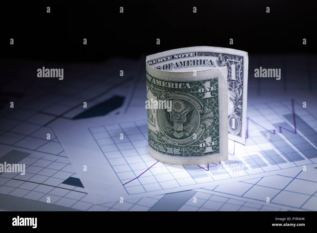 Financial background. Closeup of one dollar note standing on paper with ...