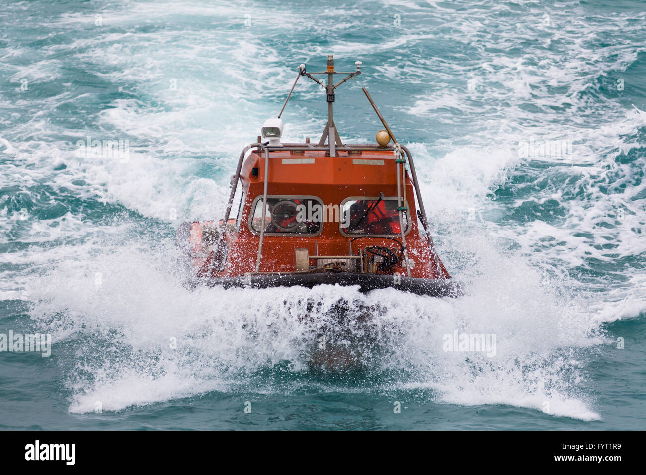The boat cuts through the waves in the open sea Stock Photo - Alamy