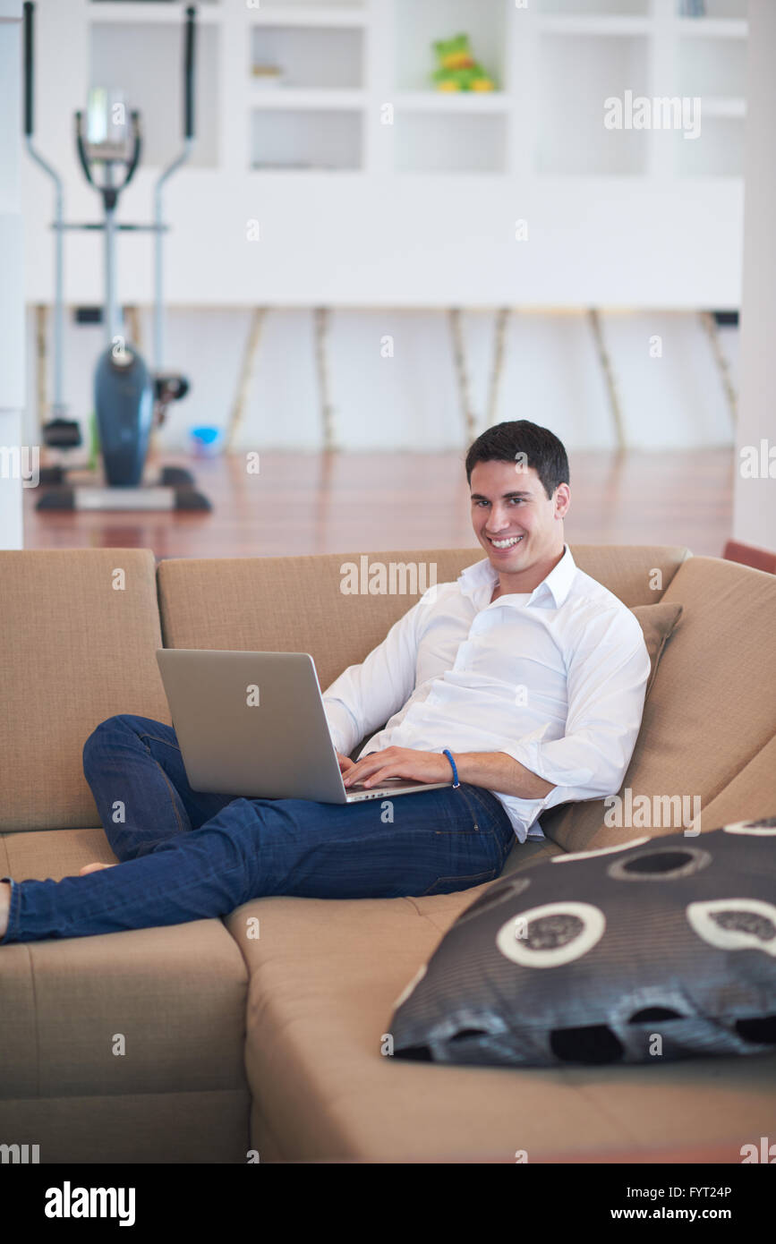working on laptop computer from home Stock Photo - Alamy