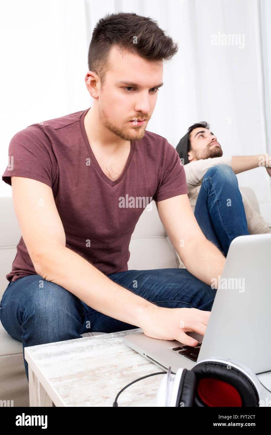 Two guys studying at home Stock Photo - Alamy