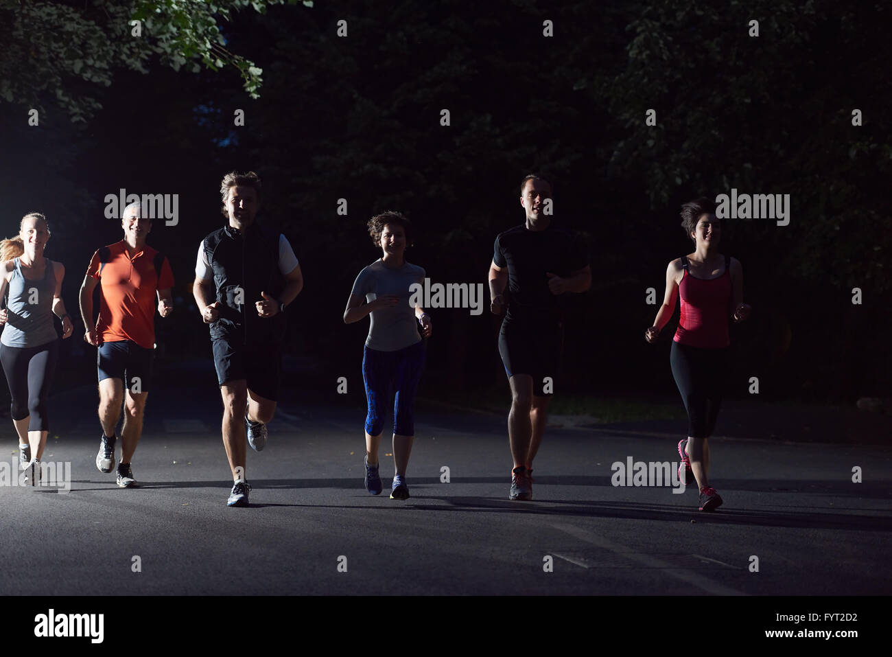 people group jogging at night Stock Photo - Alamy