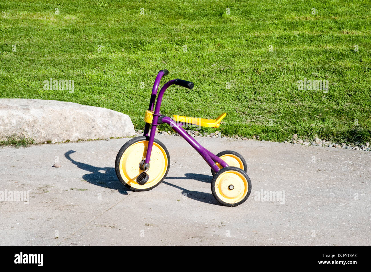 Tricycle in park Stock Photo - Alamy