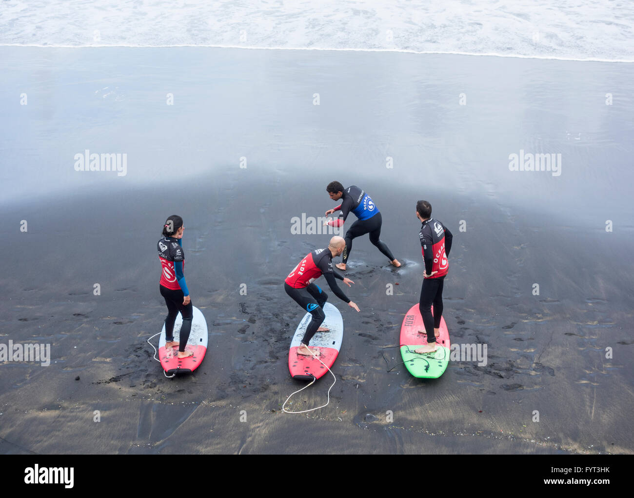 Surf lesson on beach Stock Photo - Alamy