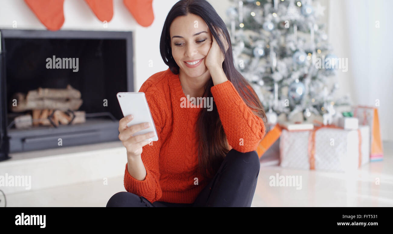 Young woman checking out her text messages Stock Photo - Alamy