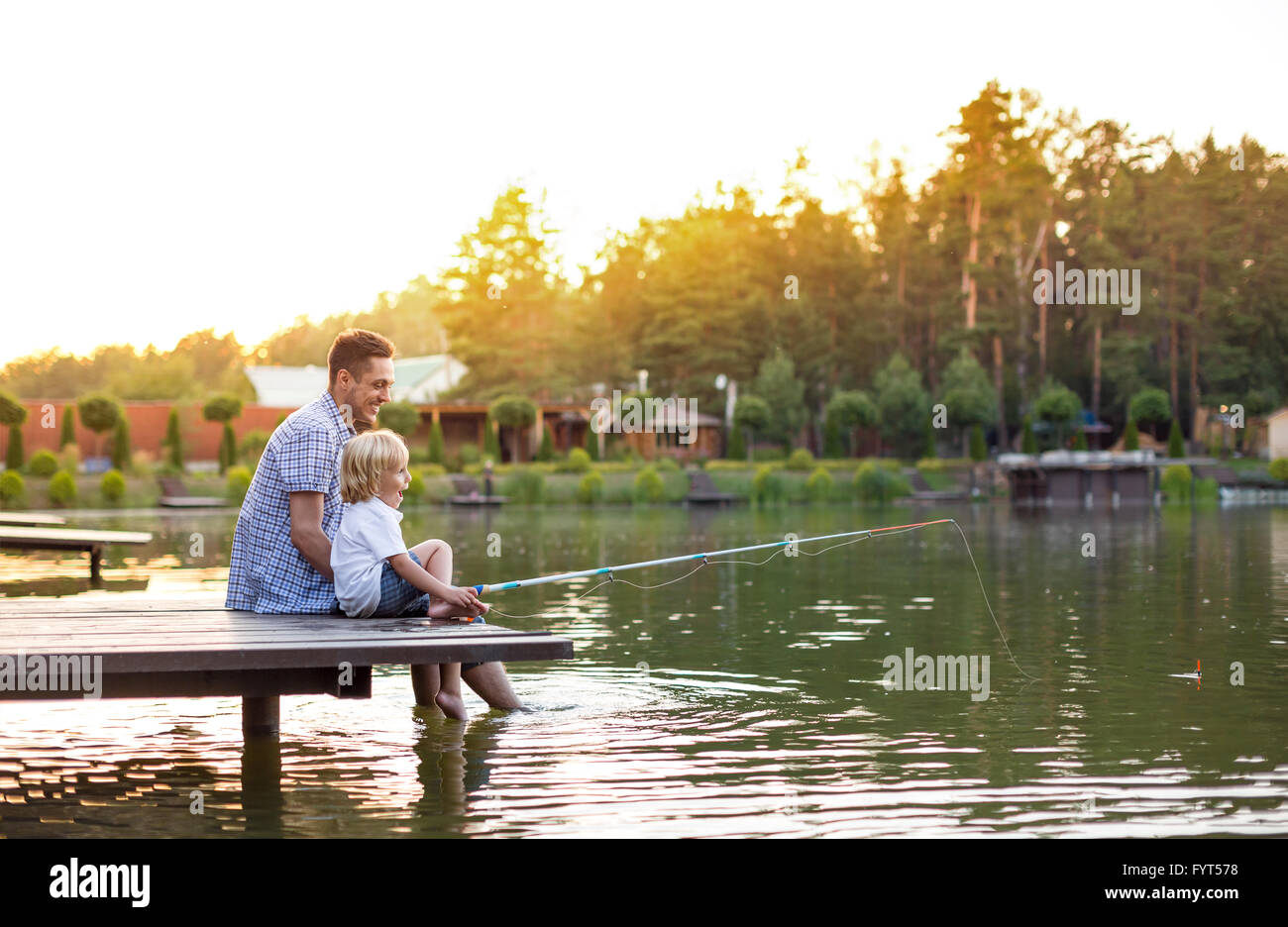 Father teaching son fishing hi-res stock photography and images - Alamy