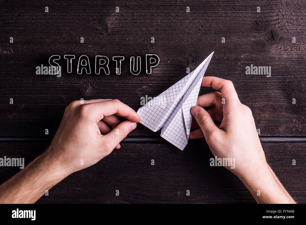 Office desk with start up sign and paper plane Stock Photo - Alamy