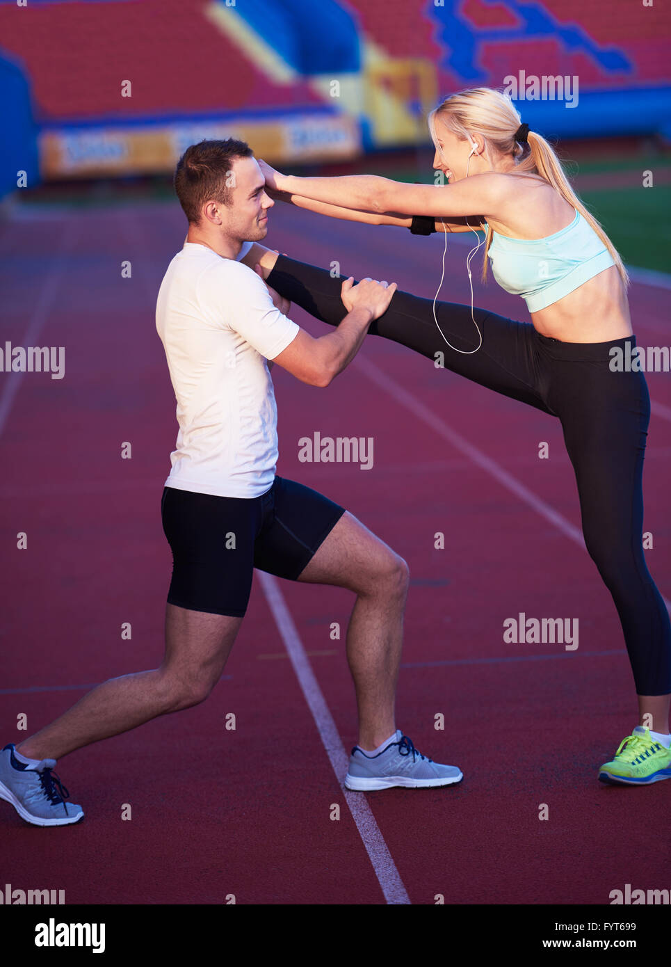 sporty woman on athletic race track Stock Photo - Alamy