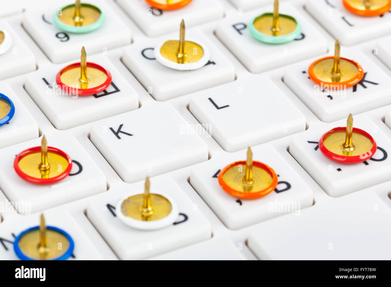 Pins on computer keyboard Stock Photo - Alamy