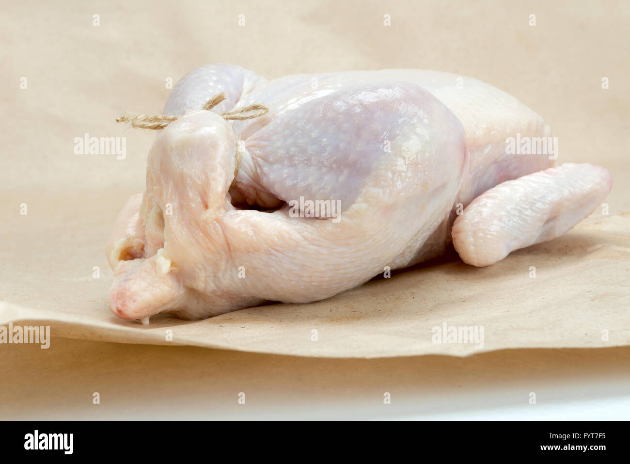 chicken for frying on the wrapping paper Stock Photo - Alamy
