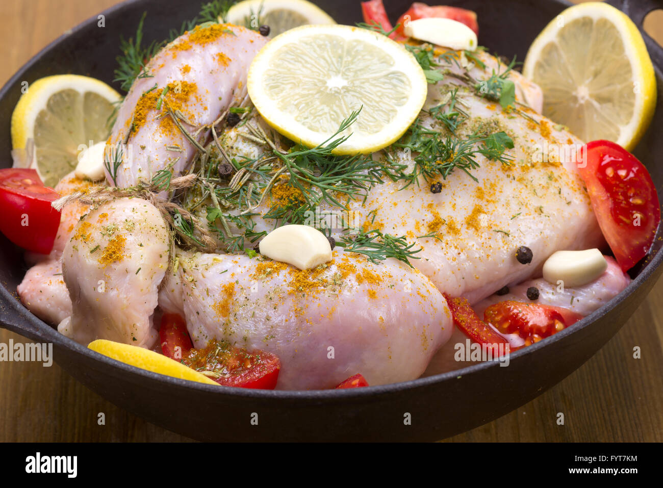 Broiler chicken and vegetables in a frying pan - preparation for ...