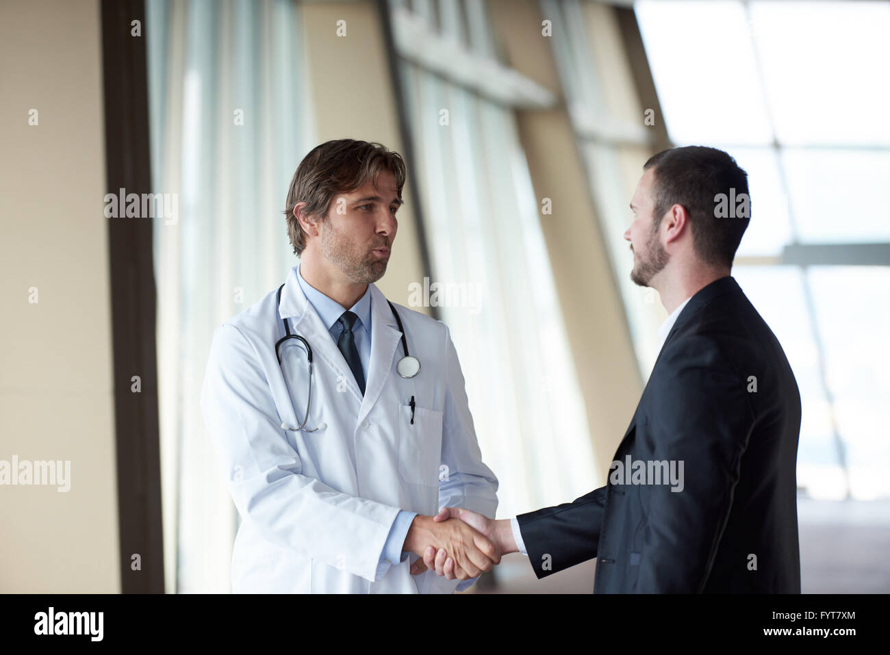 doctor handshake with a patient Stock Photo - Alamy