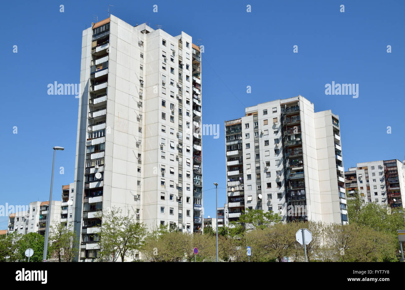 Line of residential buildings under clear spring sky Stock Photo - Alamy