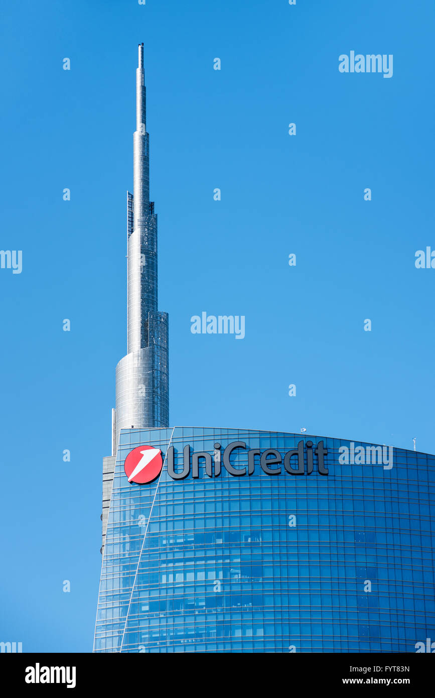 Top of UniCredit building with signage and office windows in front of ...