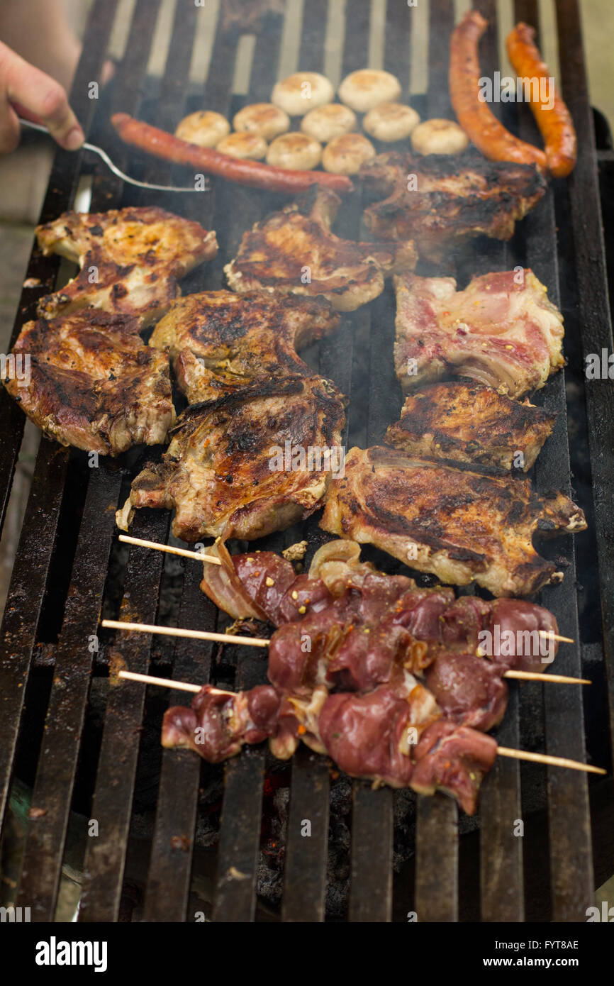 Grilled meat on the barbecue,cooked outdoor Stock Photo - Alamy