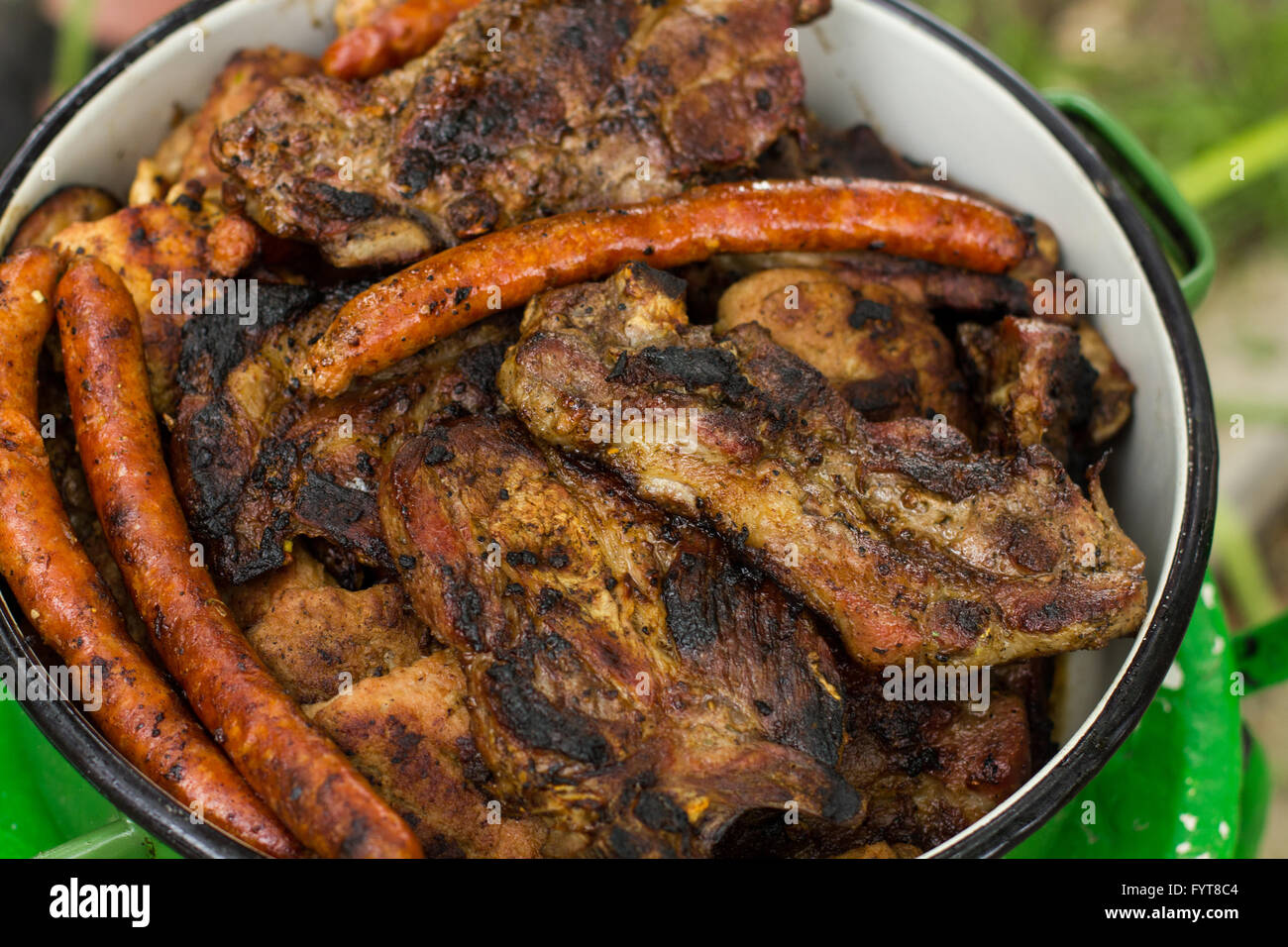 Grilled meat on the barbecue,cooked outdoor Stock Photo - Alamy