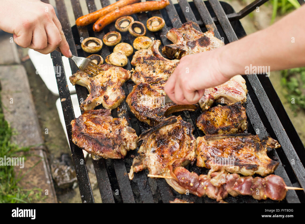 Grilled meat on the barbecue,cooked outdoor Stock Photo - Alamy