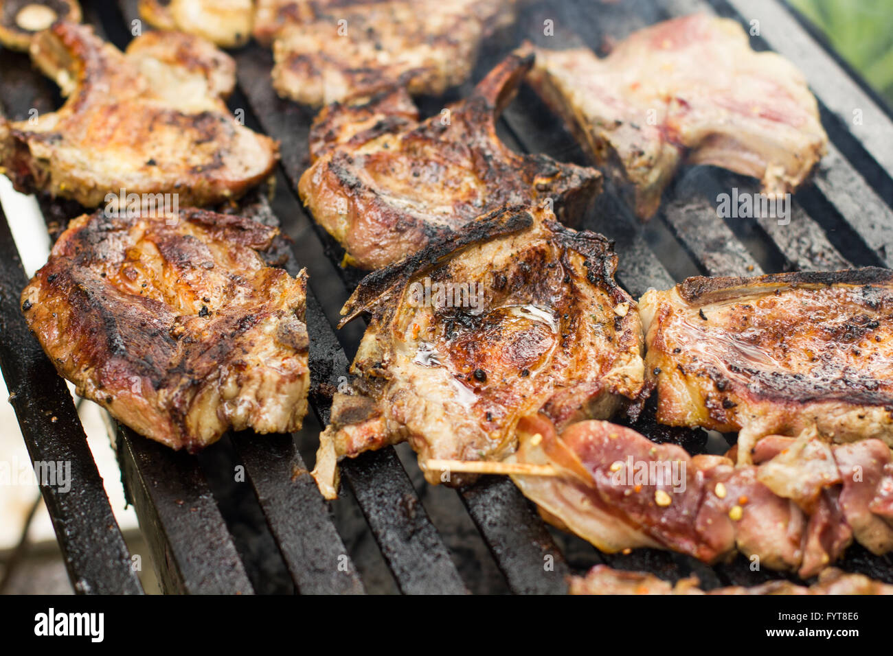 Grilled meat on the barbecue,cooked outdoor Stock Photo - Alamy