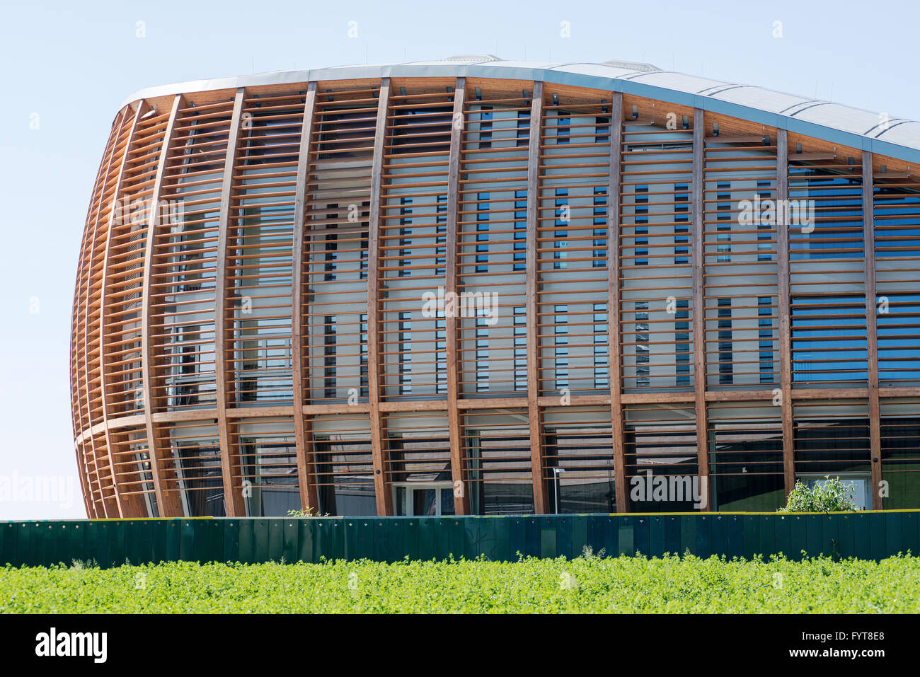 Wooden pavilion on modern Italian building with sunlight falling on its ...