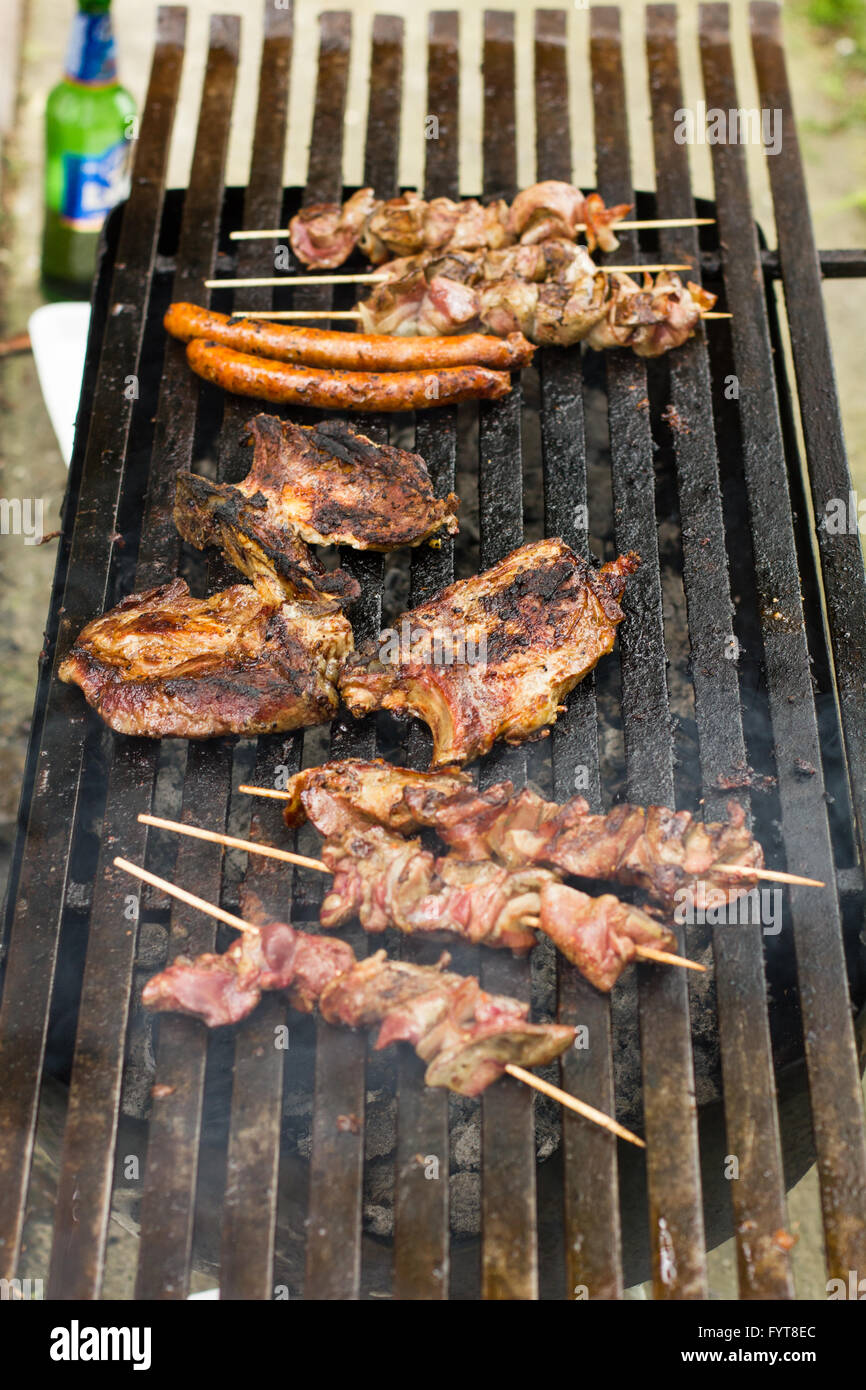 Grilled meat on the barbecue,cooked outdoor Stock Photo - Alamy