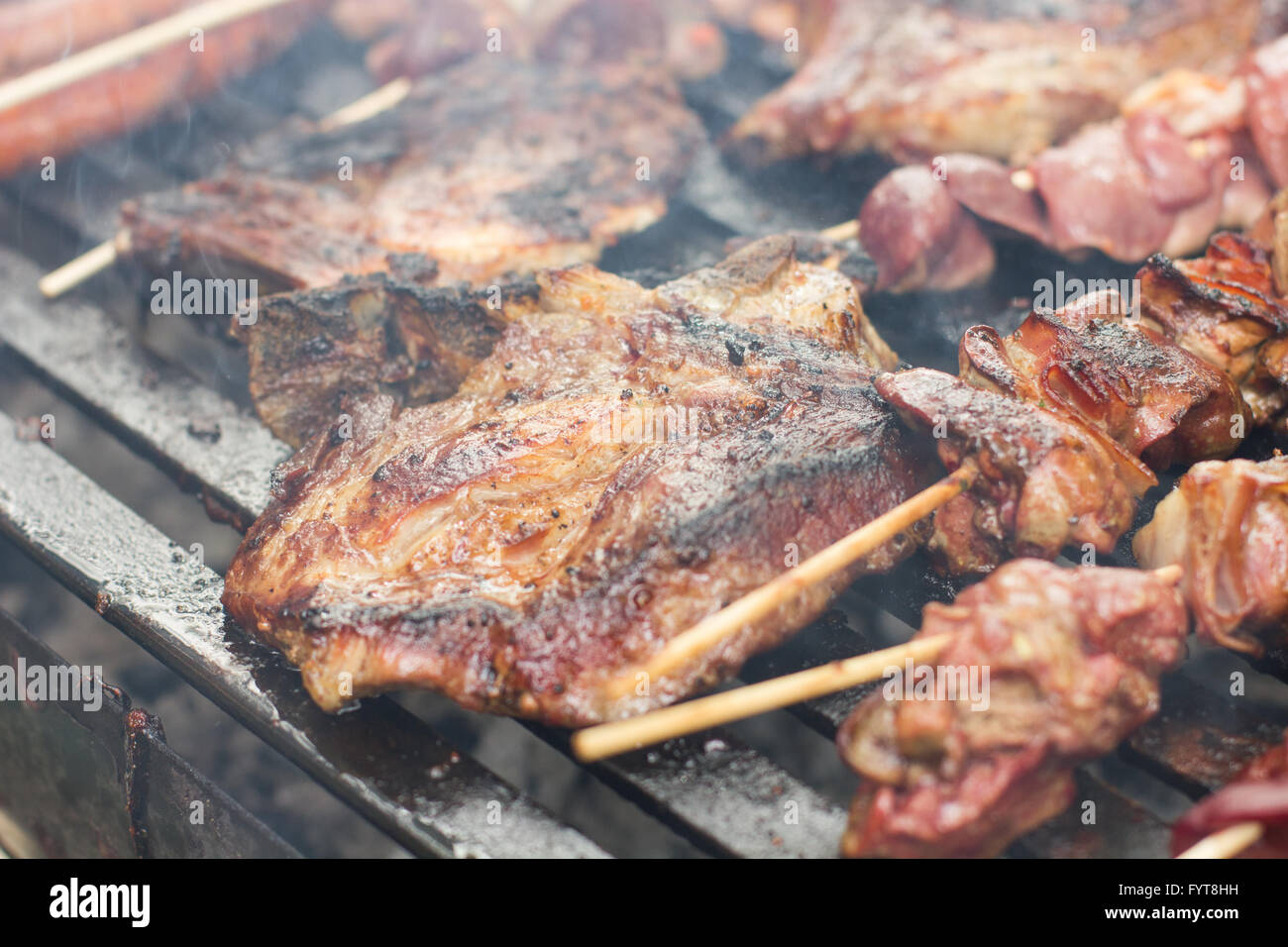 Grilled meat on the barbecue,cooked outdoor Stock Photo - Alamy