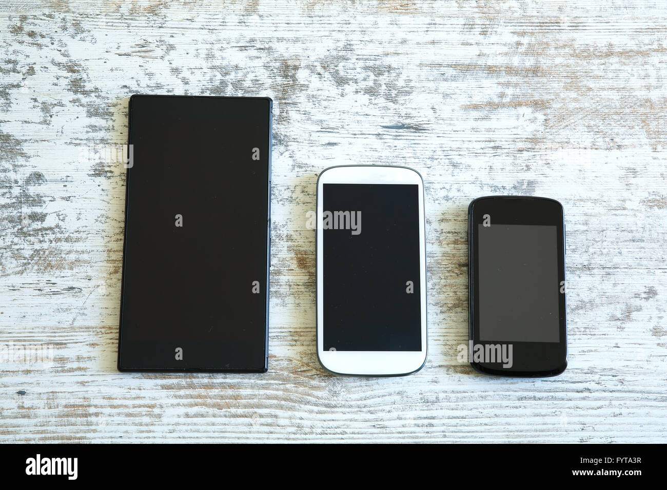 Three smartphone in different sizes Stock Photo - Alamy