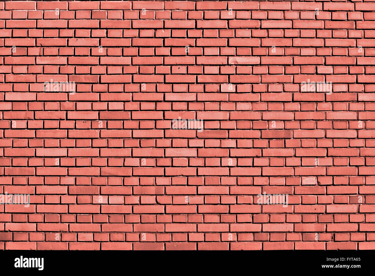 Peach echo colored brick wall background Stock Photo - Alamy