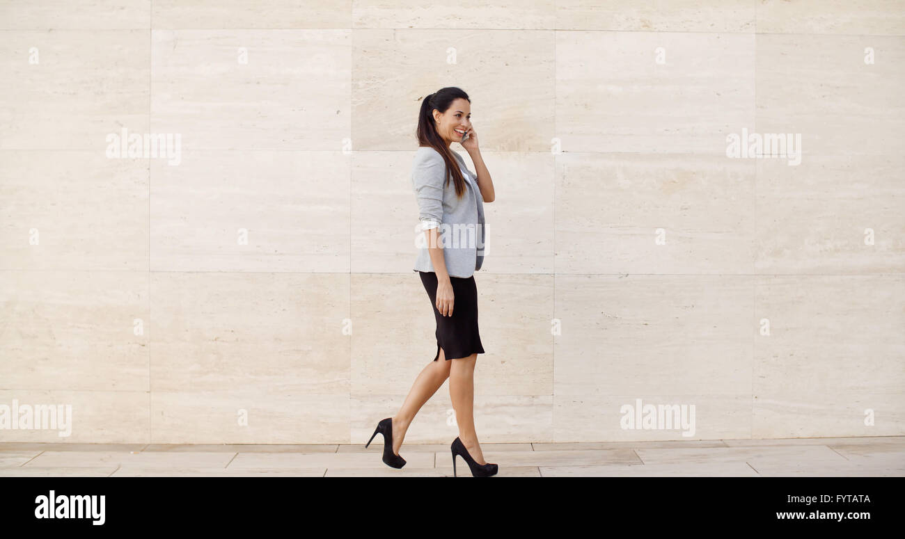 Woman walking sidewalk hi-res stock photography and images - Alamy