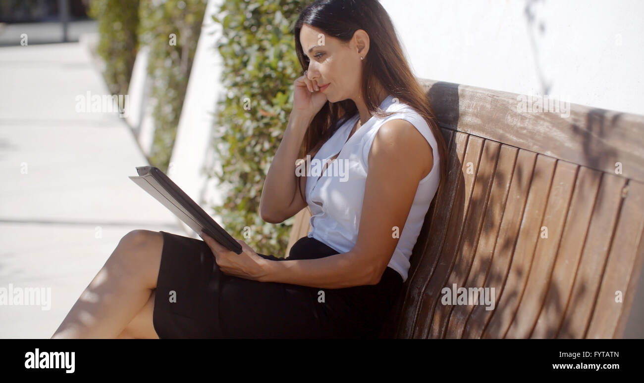 Pretty young woman surfing the internet Stock Photo - Alamy