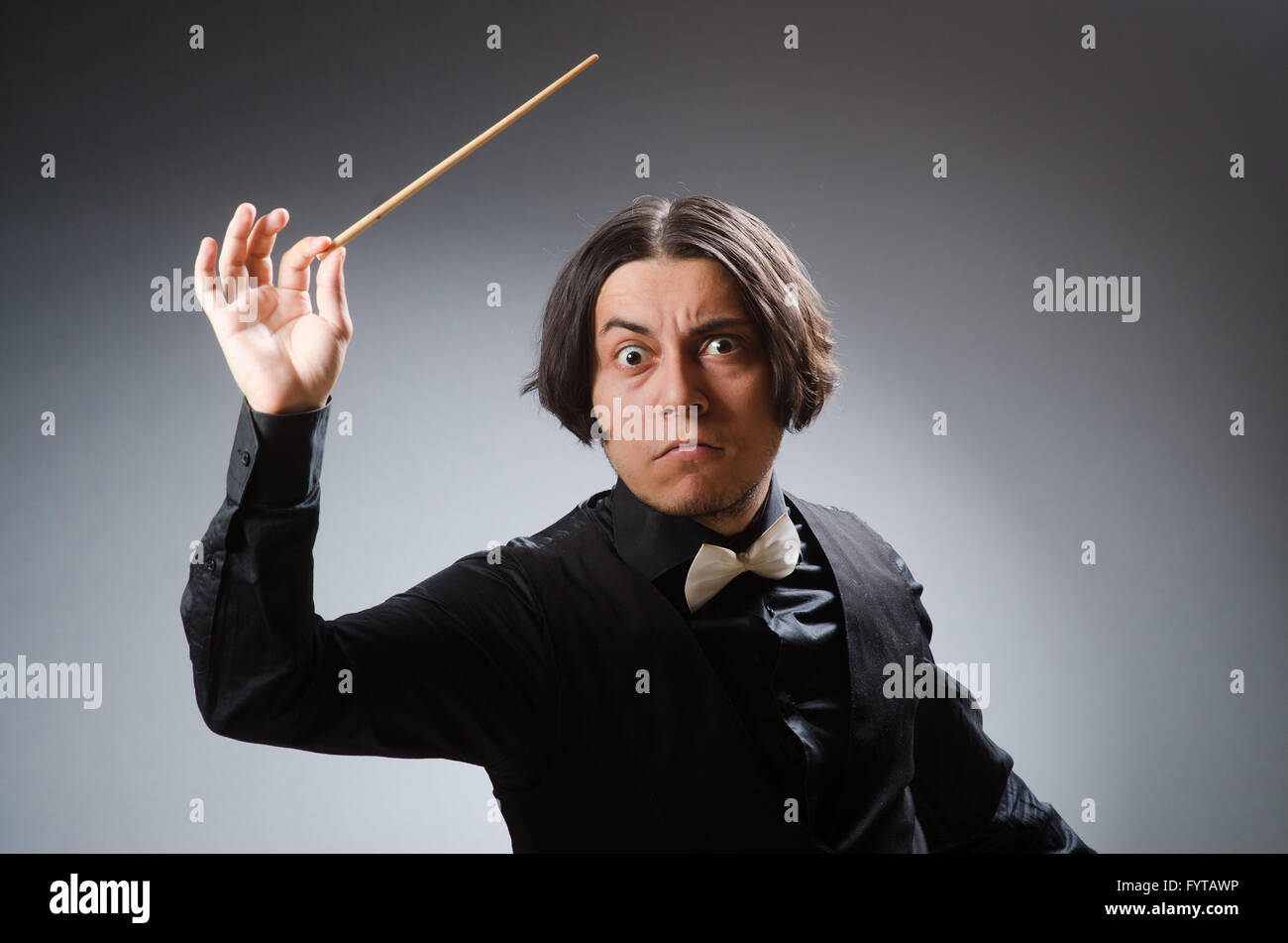 Funny conductor in musical concept Stock Photo - Alamy