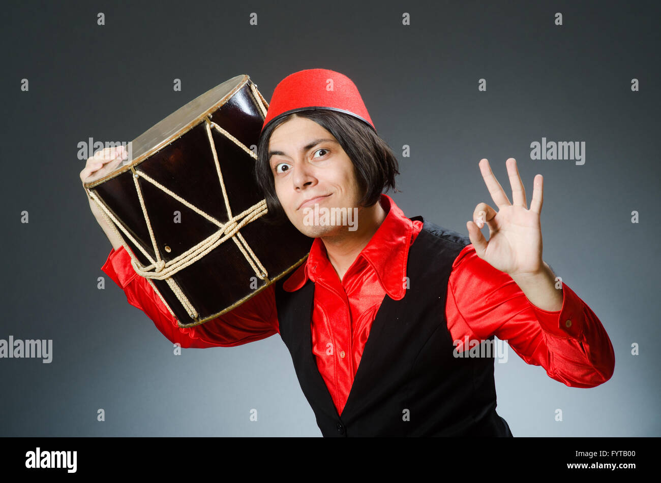 Man wearing red fez hat Stock Photo - Alamy