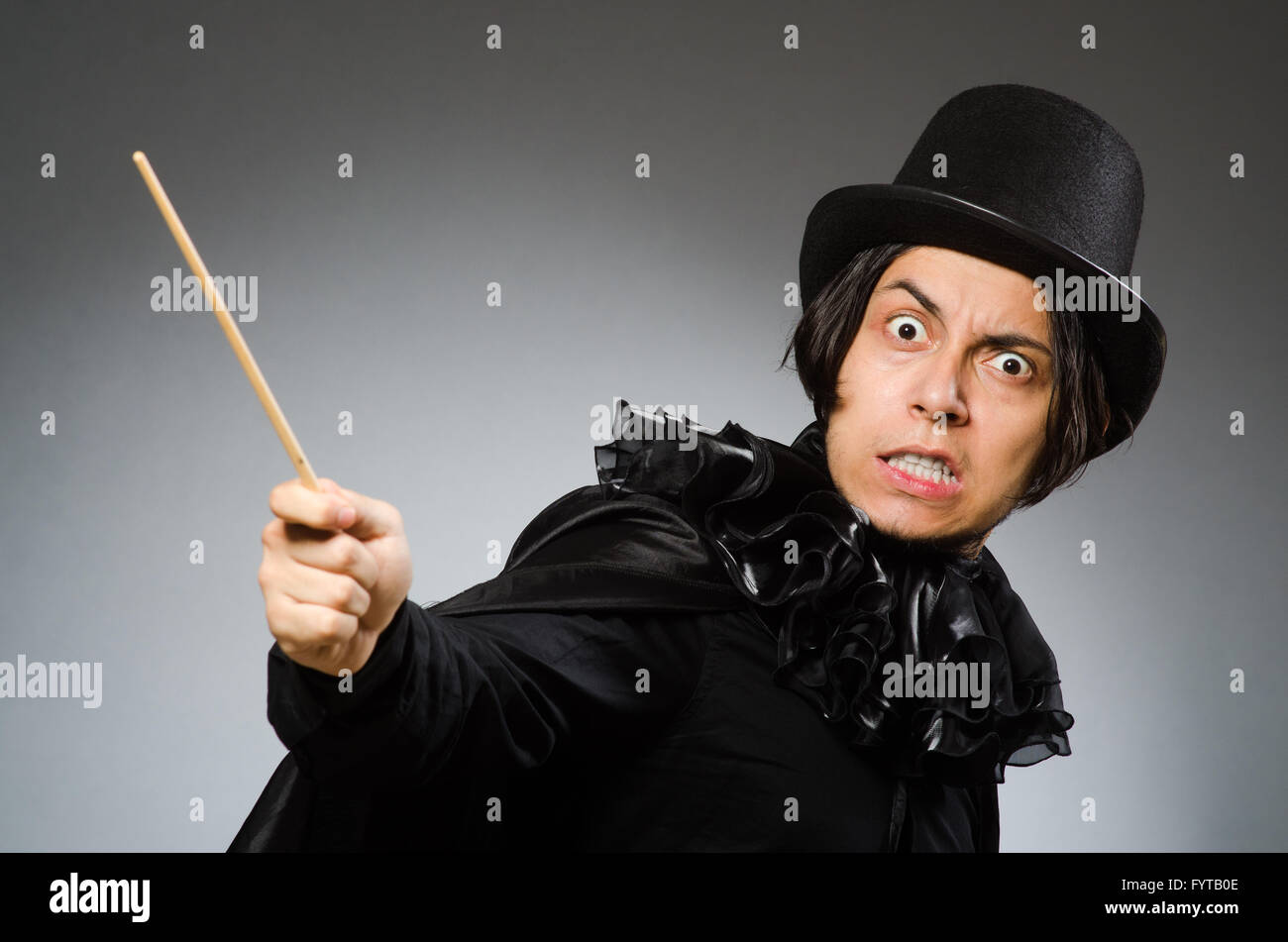Funny magician wearing cylinder hat Stock Photo - Alamy