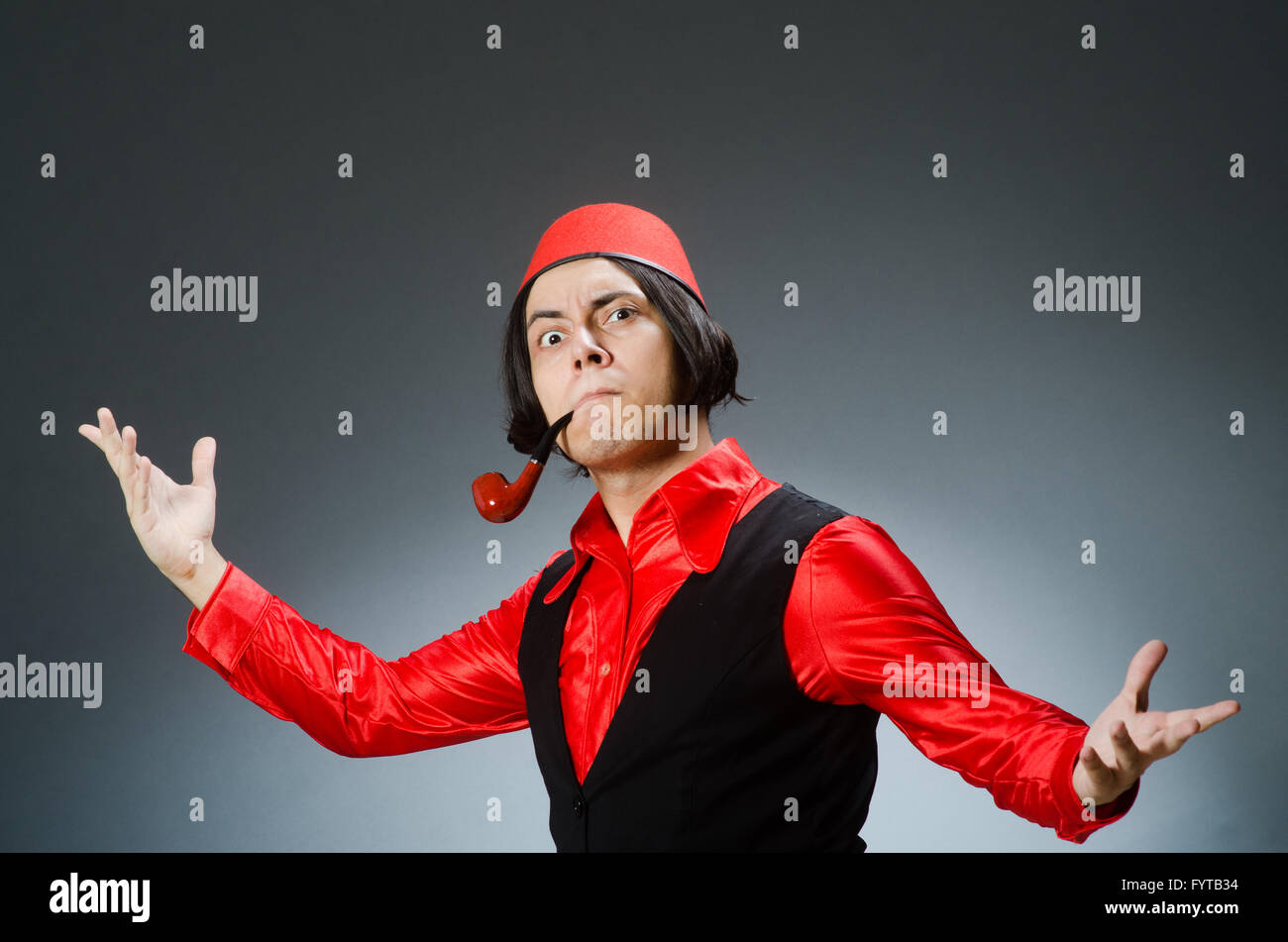 Man wearing red fez hat Stock Photo - Alamy