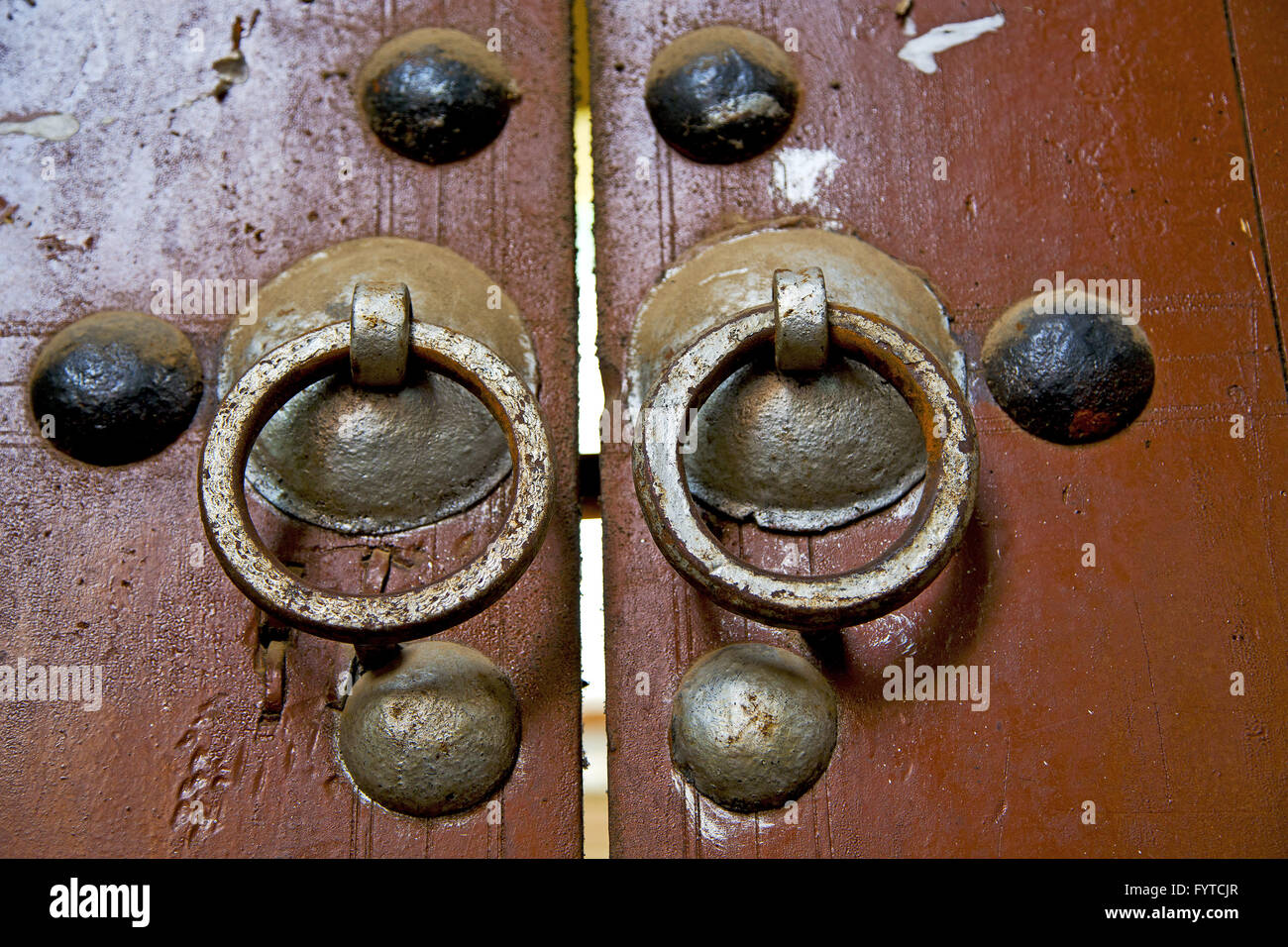 in africa the old wood facade and rusty safe padlock Stock Photo - Alamy